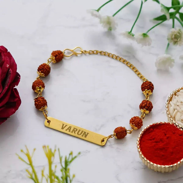 Personalized Engraved Rudraksha Name Golden Rakhi – CustomizeKaralo